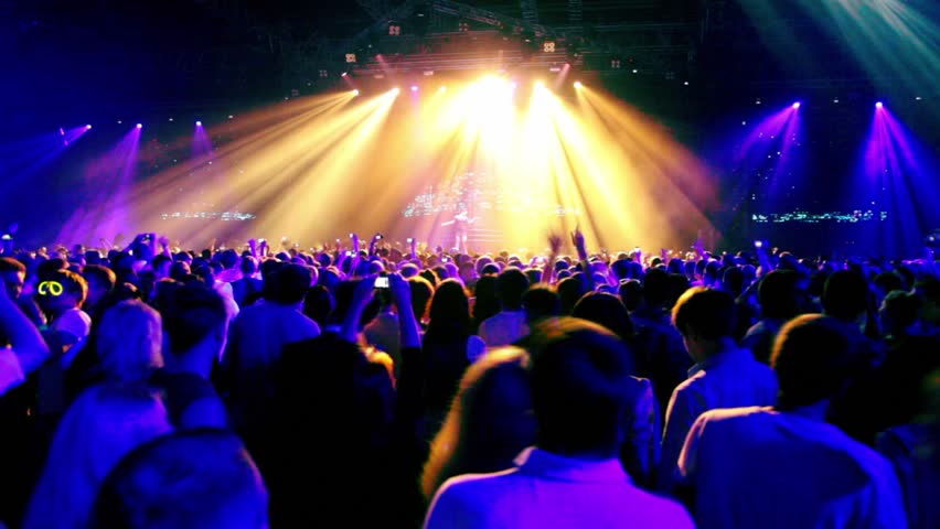 Lot Of People Clapping At Rave Party View From Behind Hands And Heads
