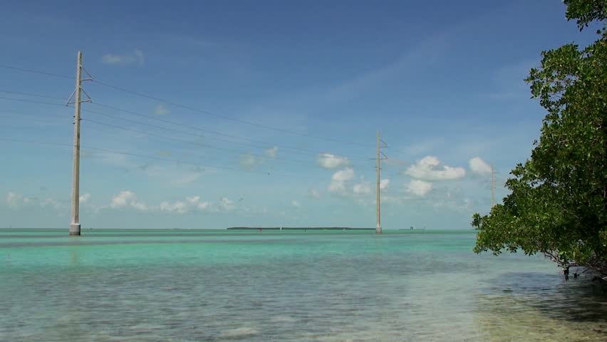 Power Lines Over Water in Stock Footage Video (100% Royalty-free ...
