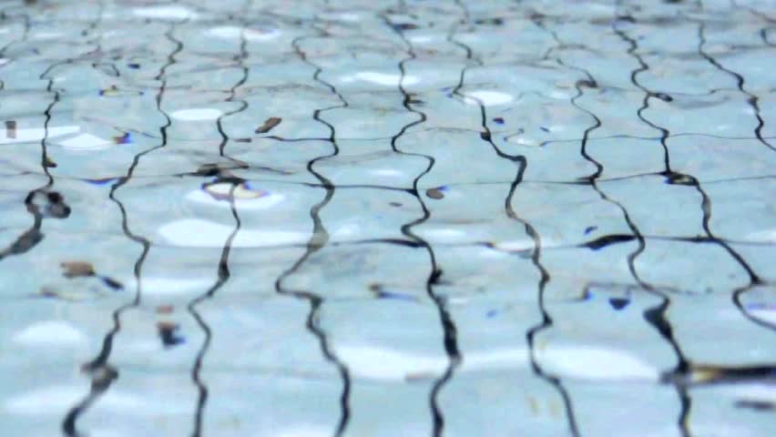 Stock Video Clip of Abstract shot of rippling water with tiles ...