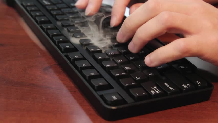 Stock Video Clip of A person burning up their keyboard with | Shutterstock