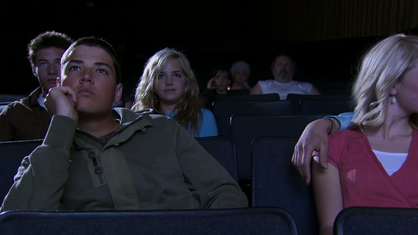 Teenage Girl Talking On Cell Phone At Movie Theater Stock Footage Video ...