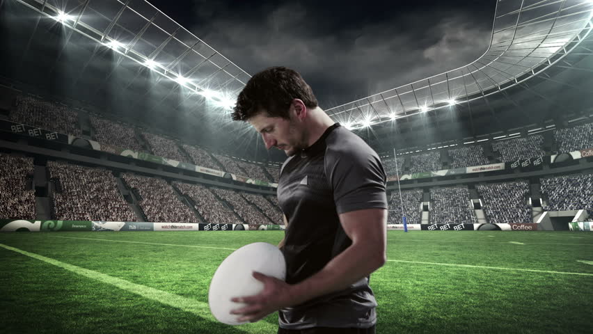Videoclip de Serious rugby player holding rugby ball in | Shutterstock