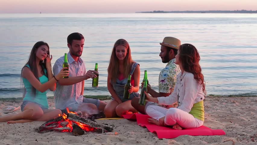 Cheerful Young People Drink Beverages On The Lake. Travel To The Island ...