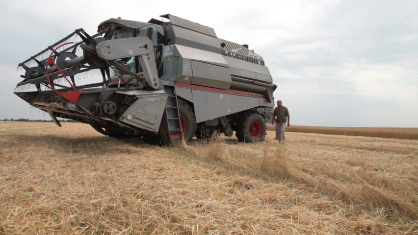 Harvester Worker in a Field Stock Footage Video (100% Royalty-free ...