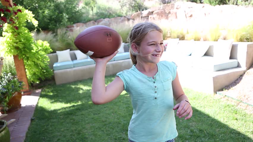 Preteen Girl Throwing Football Stock Footage Video (100% Royalty-free ...
