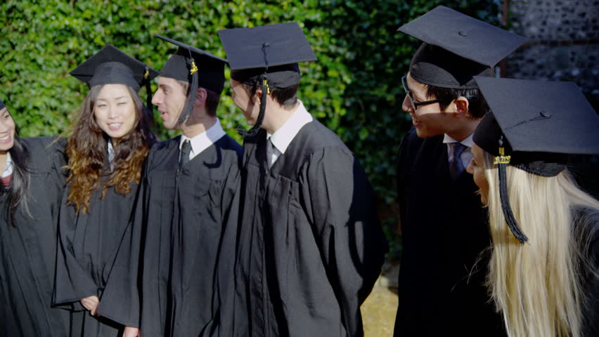 4k / Ultra HD Version Graduation Caps Are Tossed Into The Air On A ...