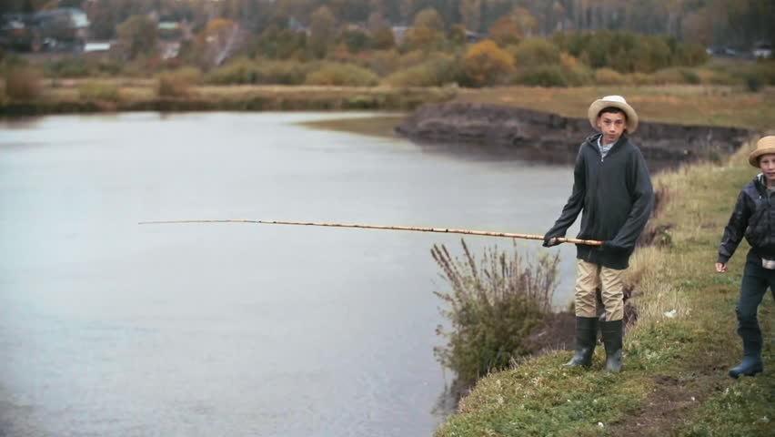 Stock video of little boy catching a big fish | 14421460 | Shutterstock