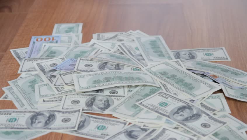 Money Scattered On The Floor Are Collected In A Plastic Bag Stockvideos ...