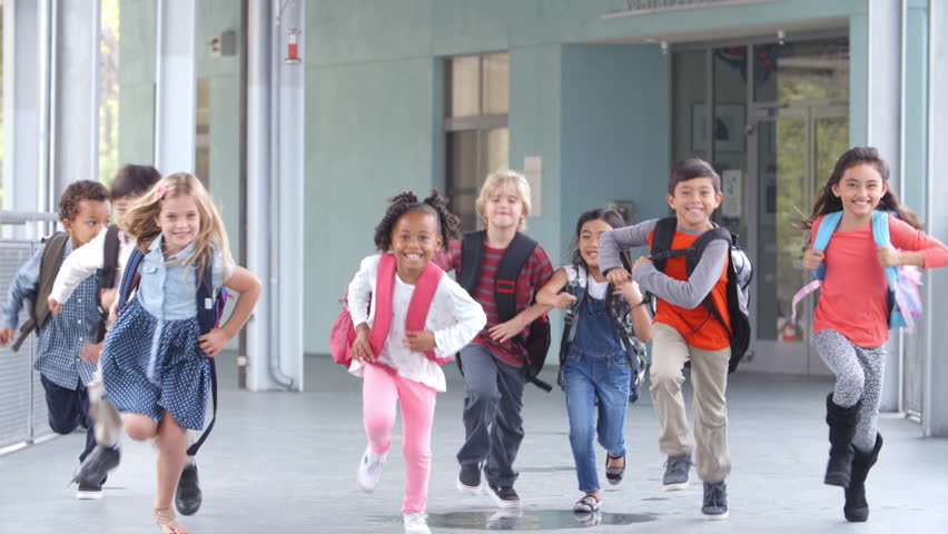 Excited Pupils Running Down School Corridor Towards Camera Stock ...
