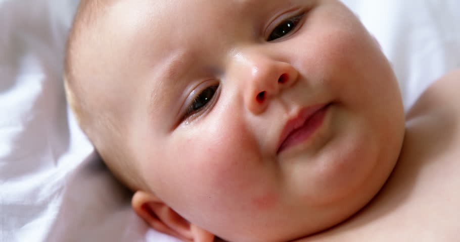 Close Up Of A Happy Three Month Old, Asian Baby Girl Wriggling Around ...