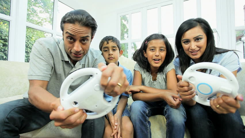 Stock video of young asian parents playing on games | 1653040 ...