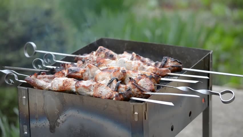 Beef And Beef Steak,sausage And Chicken Leg On Swaying Schwenker Grill ...