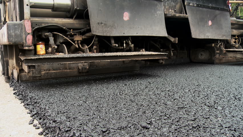 Asphalt Paver Applying Asphalt On The Highway. An Equipment Used To ...