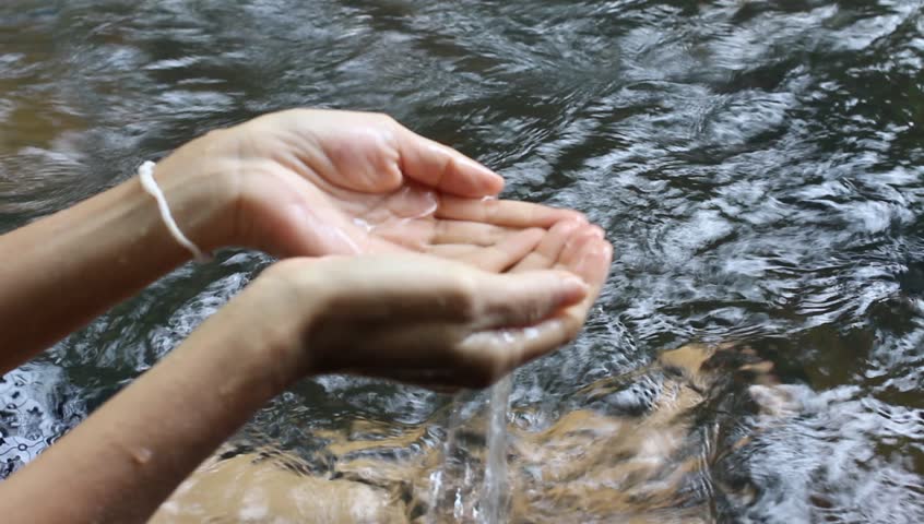 SLOW MOTION: Hand Scooping Fresh Water In Pure Mountain Spring Stock ...