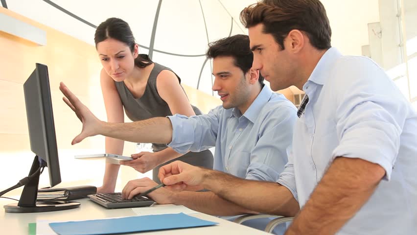 Group Of Business People Using Laptop And Tablet Computer During A ...