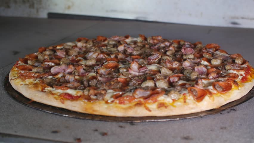 Slow Motion Close-up Of Drooping Slice Of Pepperoni Pizza Cooked In ...