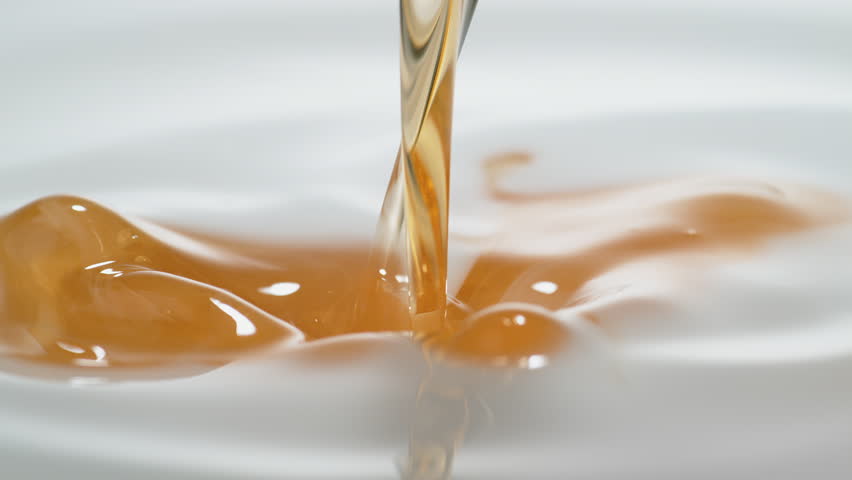 Pouring Oil Into Milk. Shot Stock Footage Video (100% Royalty-free ...