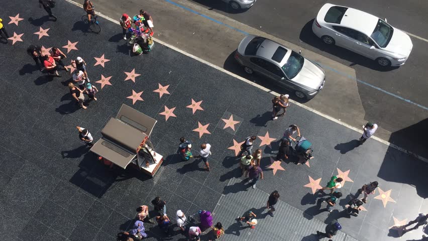 LOS ANGELES - APRIL 6: People Walking On Famous Walk Of Fame At ...