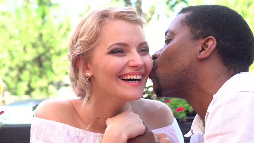 Mixed-race Couple Kissing In In A Cafe In Summer Day. Happy African ...