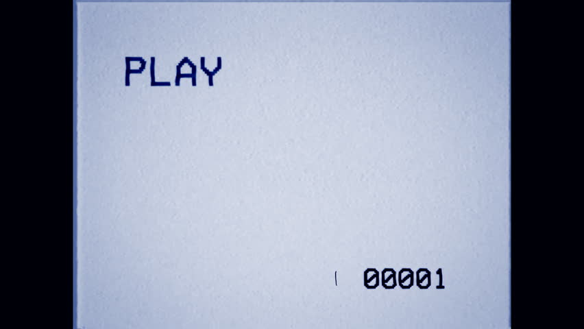 An Old Damaged VHS Tape Playing, Blue Screen With PLAY Text. A Vintage ...