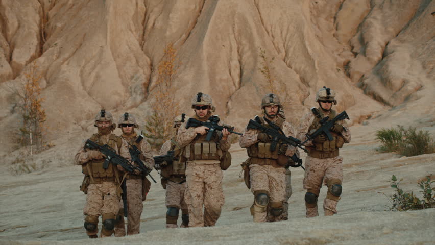 Group Of Fully Equipped And Armed Soldiers Walking Forward Outwards ...