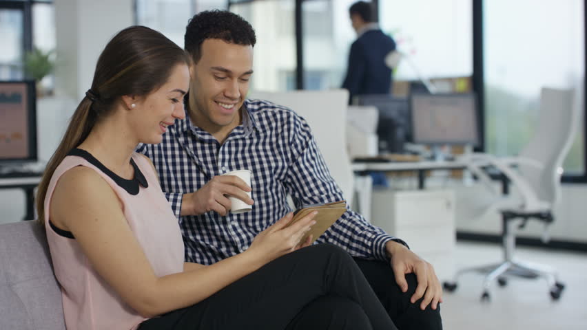 4K Young Couple Chatting & Using Computer Together In City Apartment ...