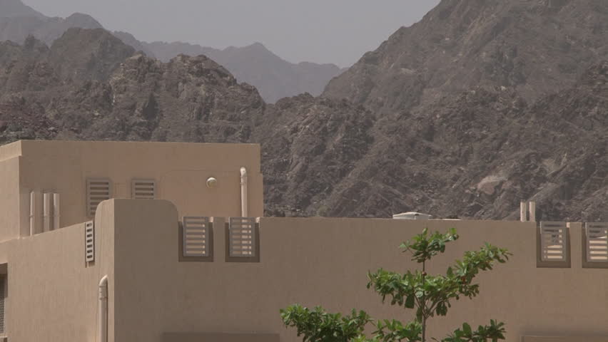 Hatta, Dubai. Tilt Down From Sky To The Hatta Fort Hotel With The Hajar ...
