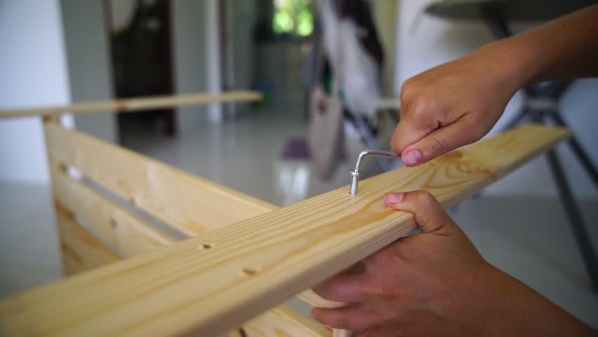 Screwing With Power Drill Close Up 4K. Person Hand Holding Wooden Desk ...