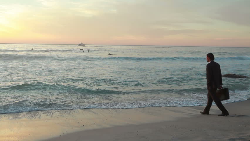 Well Dressed Businessman Walks Into The Ocean To Unwind Stockvideoklipp ...