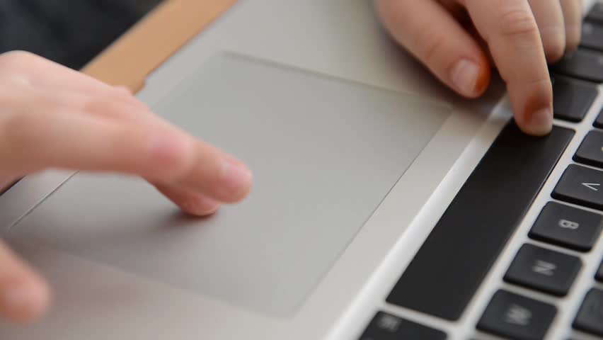 Closeup Of Fingers Using A Laptop Touchpad To Zoom In And Swipe ...