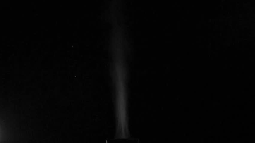 FX Light, Steady Stream Of Gravel Falling Against Black Background. A ...