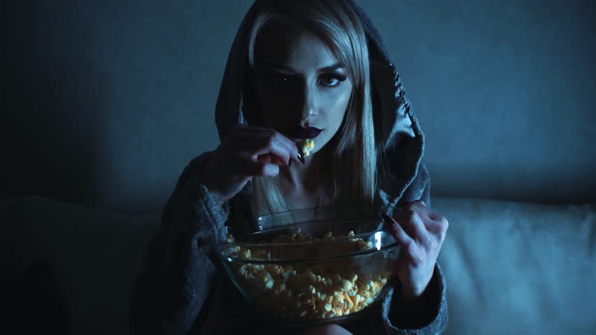 Beautiful Blonde Girl Watching Movie On Couch While Eating Popcorn ...