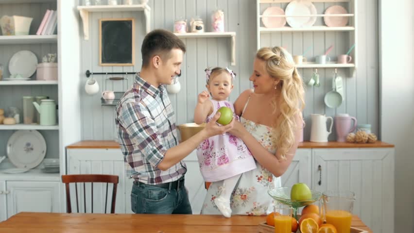 Mother Father And Daughter Cooking Dinner In Kitchen, Happy Family, Mom ...