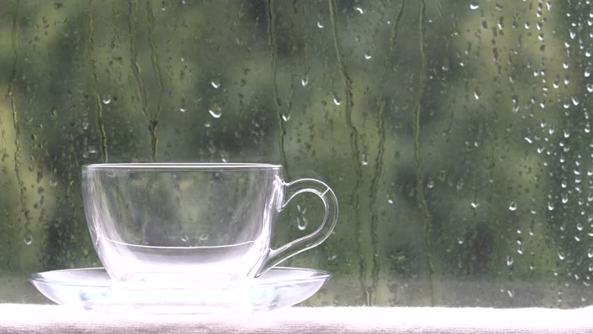 Steaming Coffee Cup On A Rainy Day Window Background Stock Footage ...
