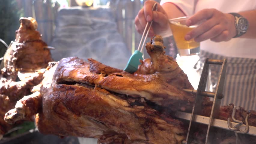 Stock video of the calf roasting on a spit | 27224680 | Shutterstock