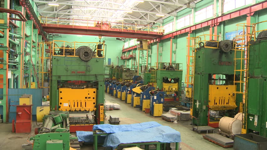 TOGLIATTI - SEP 30: Worker Puts Component Under Press Machine At Huge ...