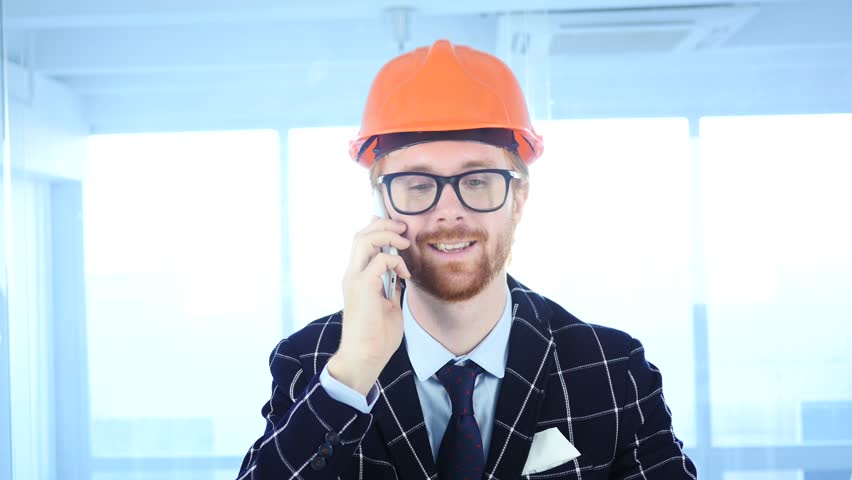 Stock Video Clip of Beard Architectural Engineer Talking on Phone ...