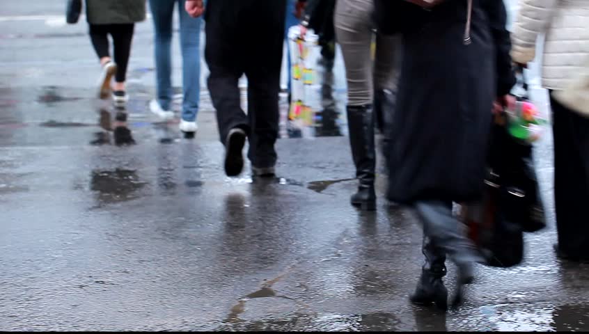 Many People Walking On A Rainy Day With Wet Shoes In The City With Rain ...