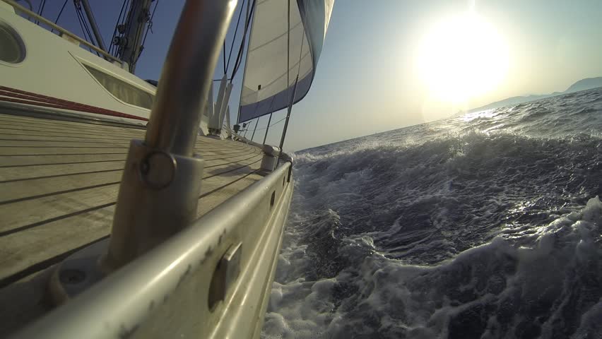 Sailing In The Wind Through The Waves During Sunset (HD) Sailing Boat ...