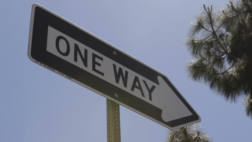 One Way Sign Against Blue Video de stock (totalmente libre de regalías ...