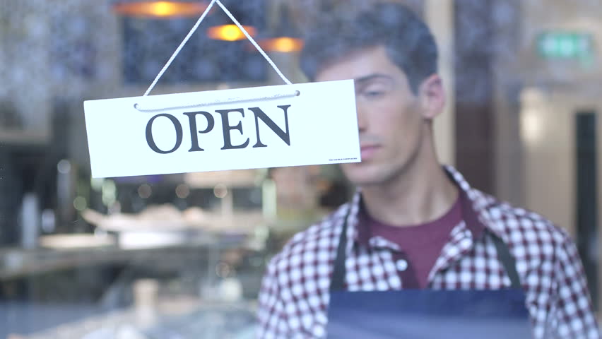 Woman Flipping Over Cafe Closed Sign Stock Footage Video 4219543 ...