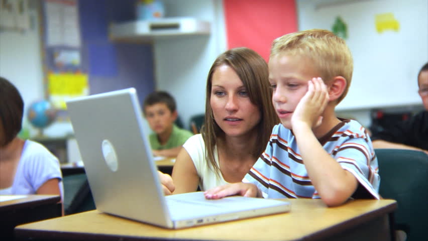 Stockvideo van elementary school student and teacher look | 4541270 ...