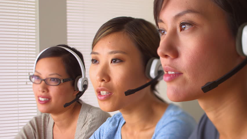 Asian Customer Service Representative With Headset In Call Center Stock ...