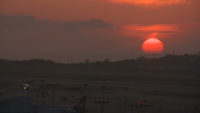 Big, Red Fireball Sun Sinking Into Purple Sky At Sunset At Oyster Bay ...