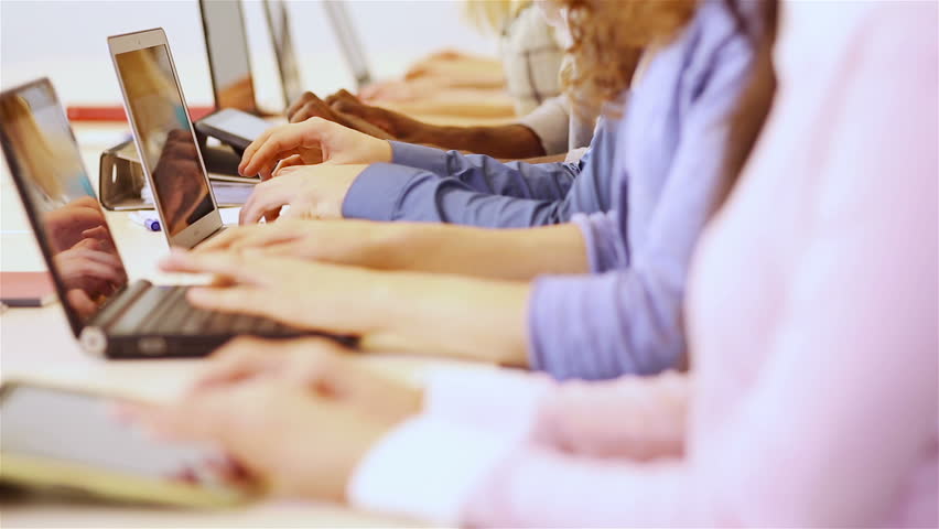 Students Typing On Tablet Computer And Laptop In A Classroom (Full HD ...