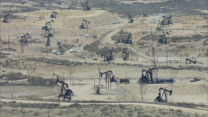 Stock video of oil rigs dirt roads hills. the | 5514350 | Shutterstock