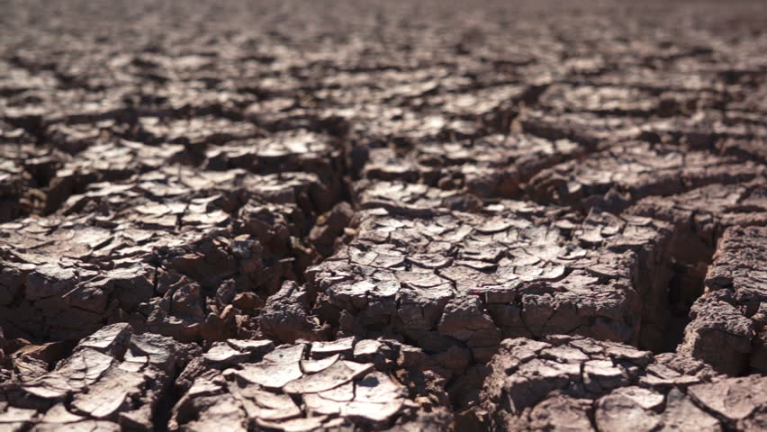 Extreme Close Up Dolly Shot Of Dried And Cracked Earth Caused By Lack ...