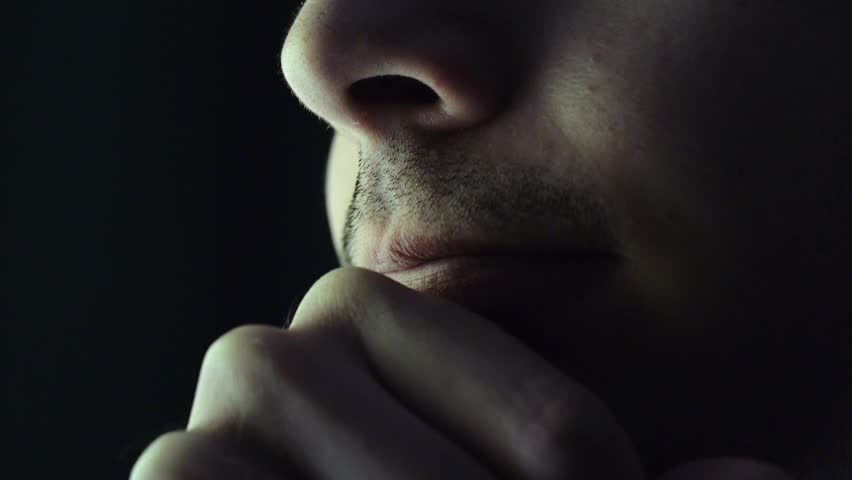 Young man thinking in darkness. 스톡 비디오 클립 | Shutterstock