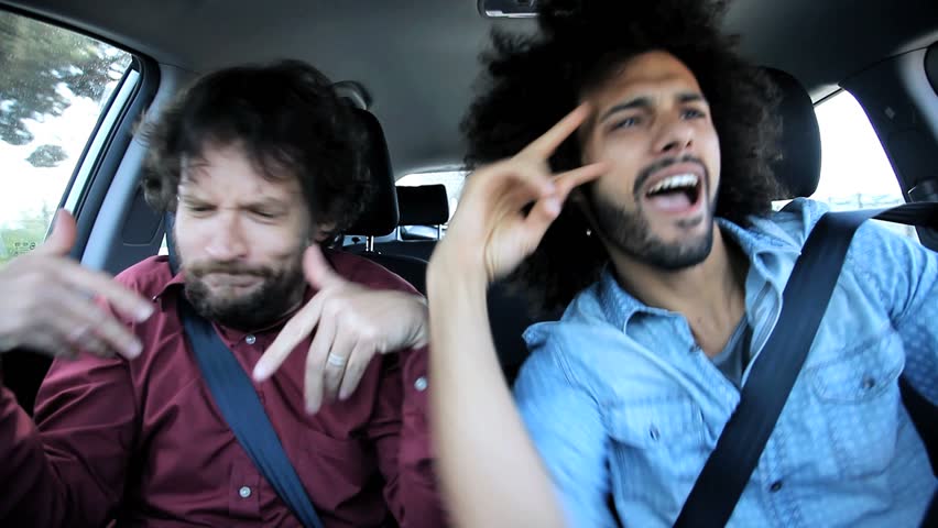 Stock Video Clip of Two drunk friends in car celebrating after ...