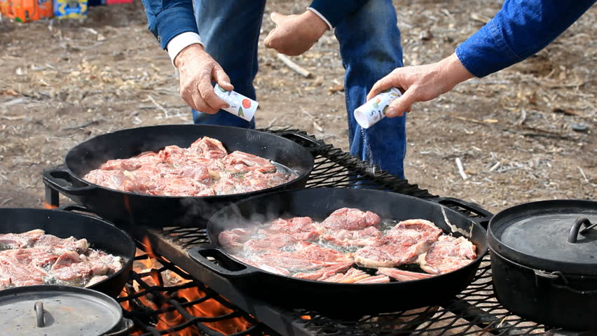 BBQ Lamb And Mutton Steaks And Chops Cooking In Cast Iron Pans Over An ...